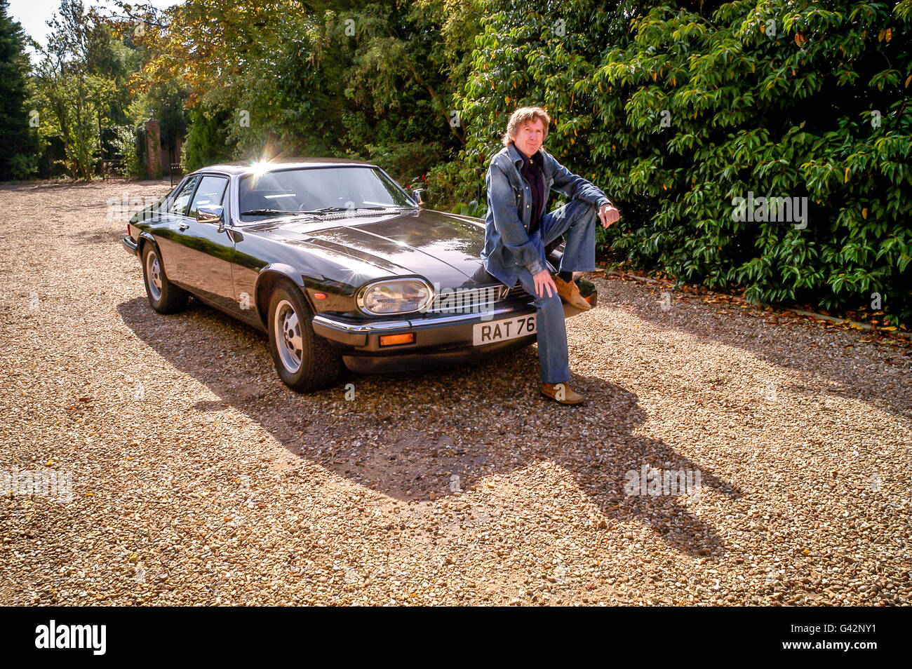 Horror writer James Herbert at home with his Jaguar V12 vehicle Stock ...