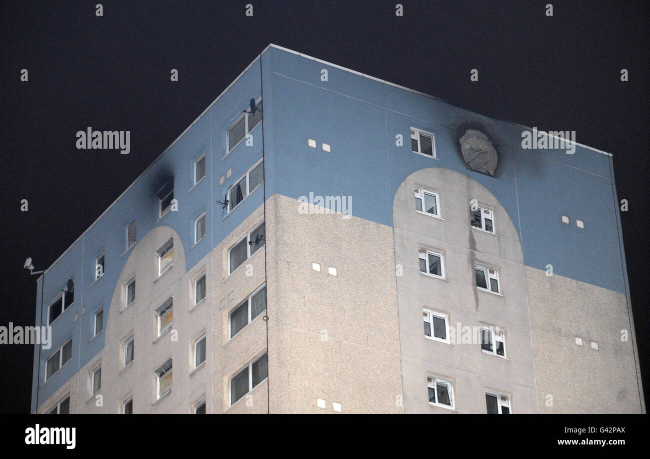 Fire damage is seen around windows on the top floor of the Marine Tower ...