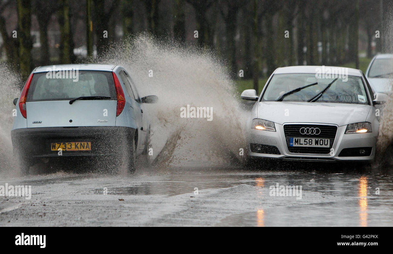 Cars make their way along Burnage Lane in Burnage, Manchester, as heavy ...
