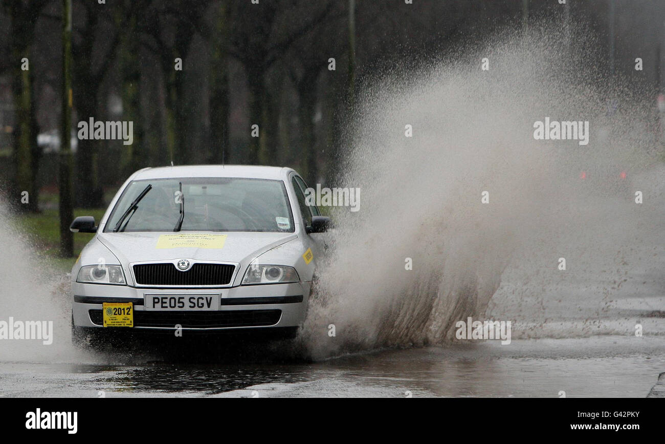 A car makes its way along Burnage Lane in Burnage, Manchester, as heavy ...