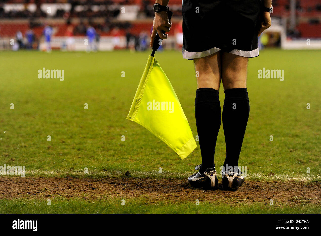 General view of the assistant referees legs and flag hi-res stock ...