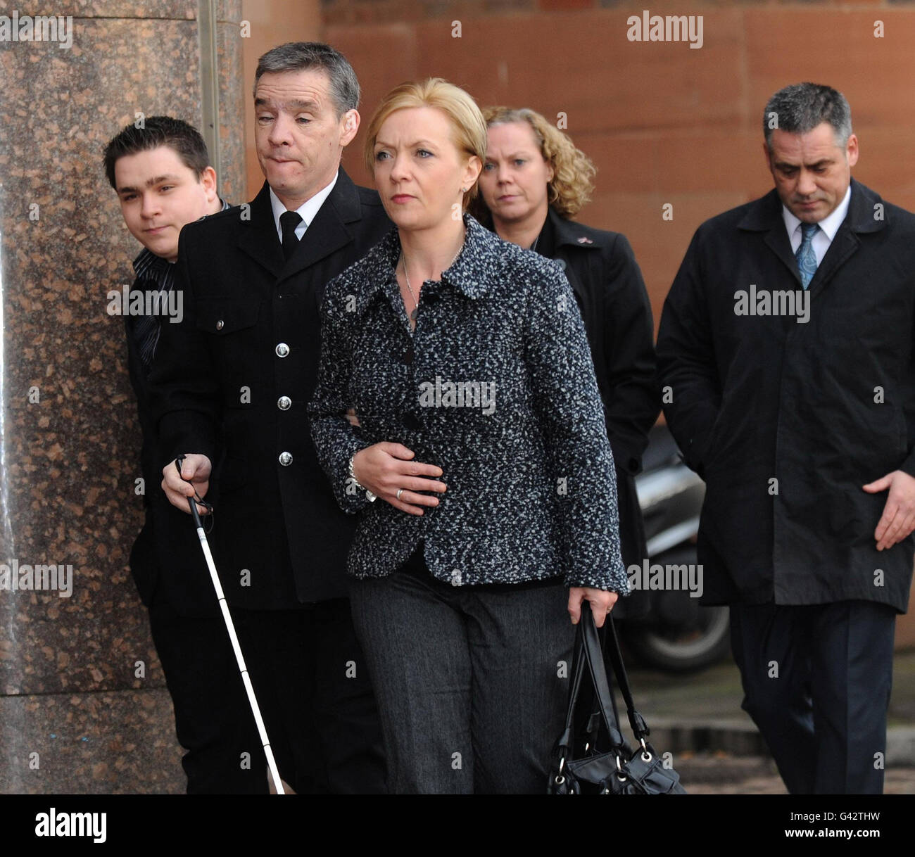 Police officer David Rathband arrives with his wife Katherine and son ...