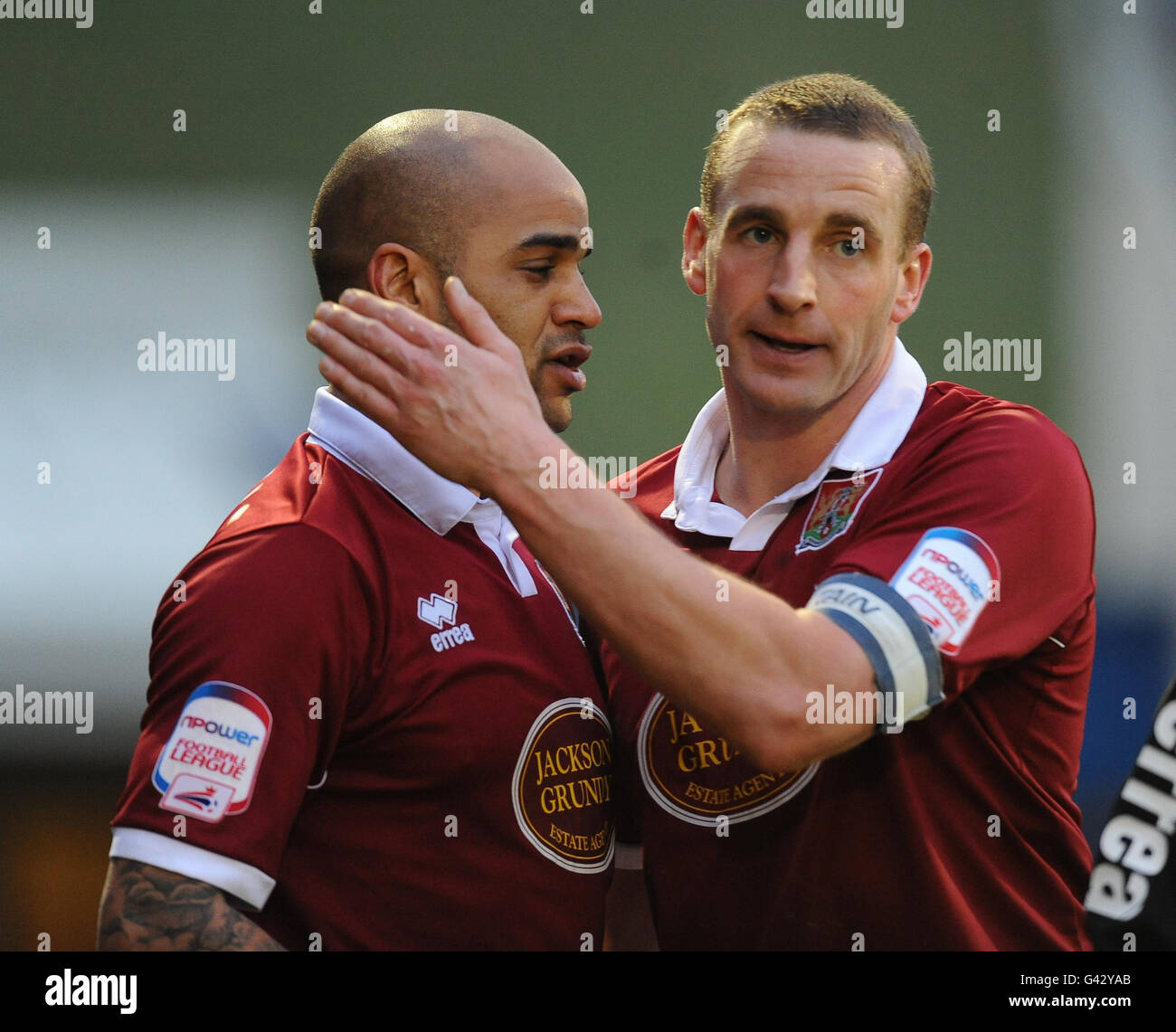 Northampton Town's Andy Holt congratulates Leon McKenzie after he ...