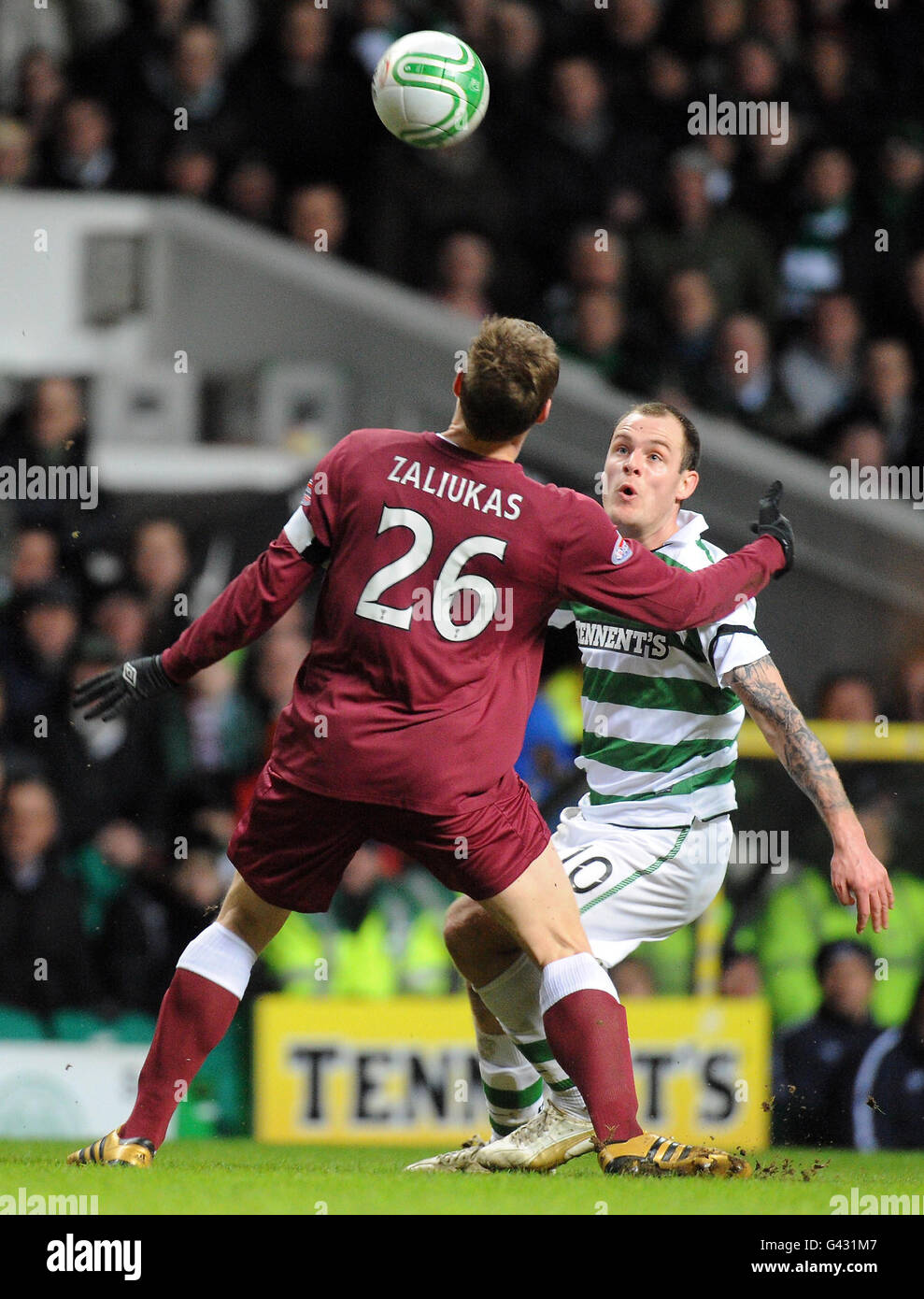 Celtic's Anthony Stokes and Hearts Marius Zaliukas challenge for the ...
