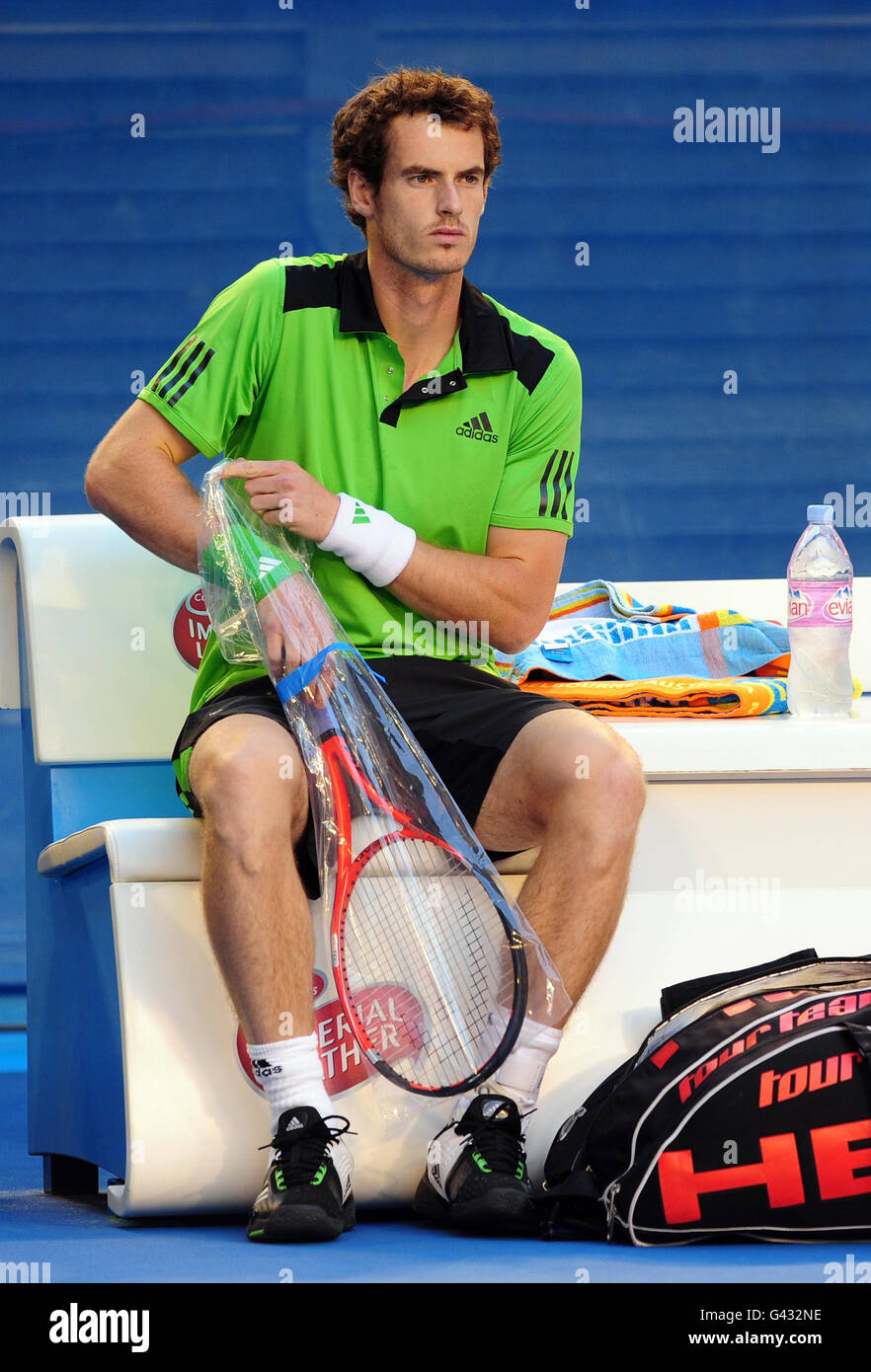 Great Britain's Andy Murray unwraps his racquet before his match ...
