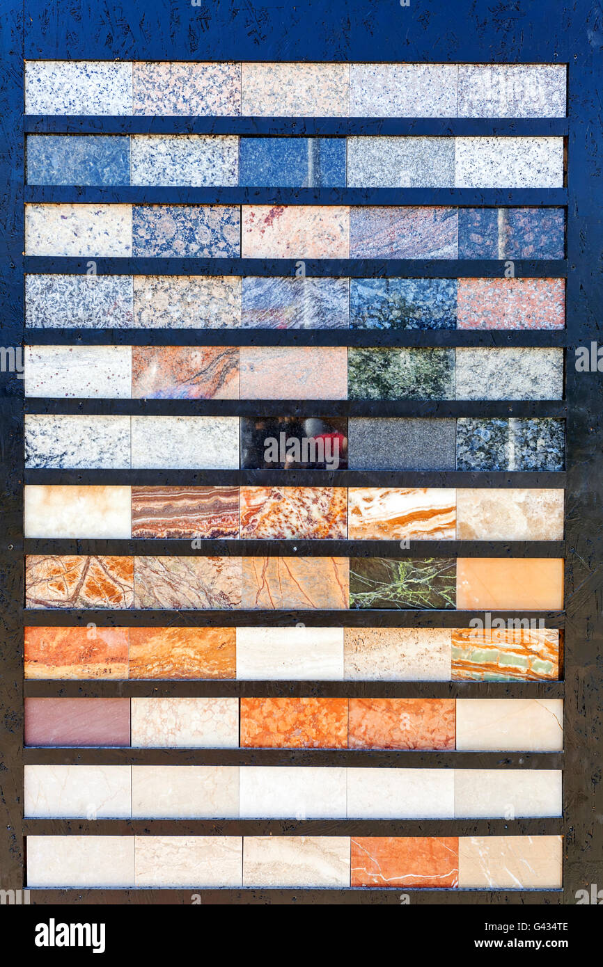 Samples of marble on the exhibition wall Stock Photo - Alamy