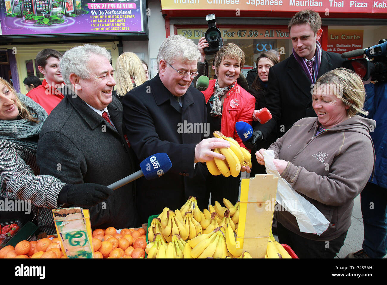 Irish Labour leader Eamon Gilmore (centre) with candidate Joe Costello ...