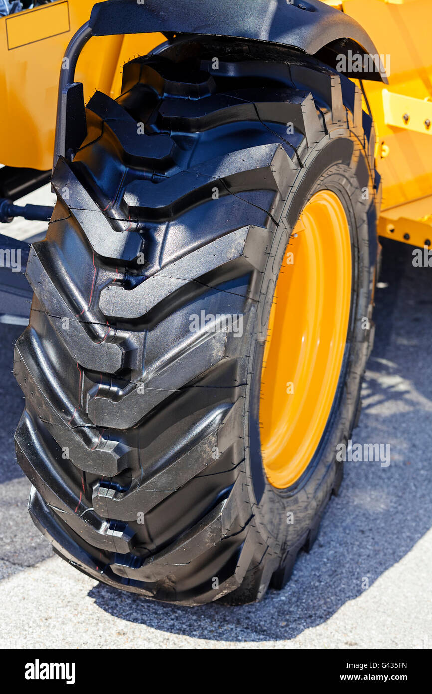 View on wheel of new excavator digging Stock Photo - Alamy