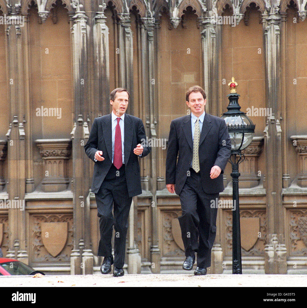 Labour leader Tony Blair (right) crosses the road with his new MP Alan Howarth at the House of ...