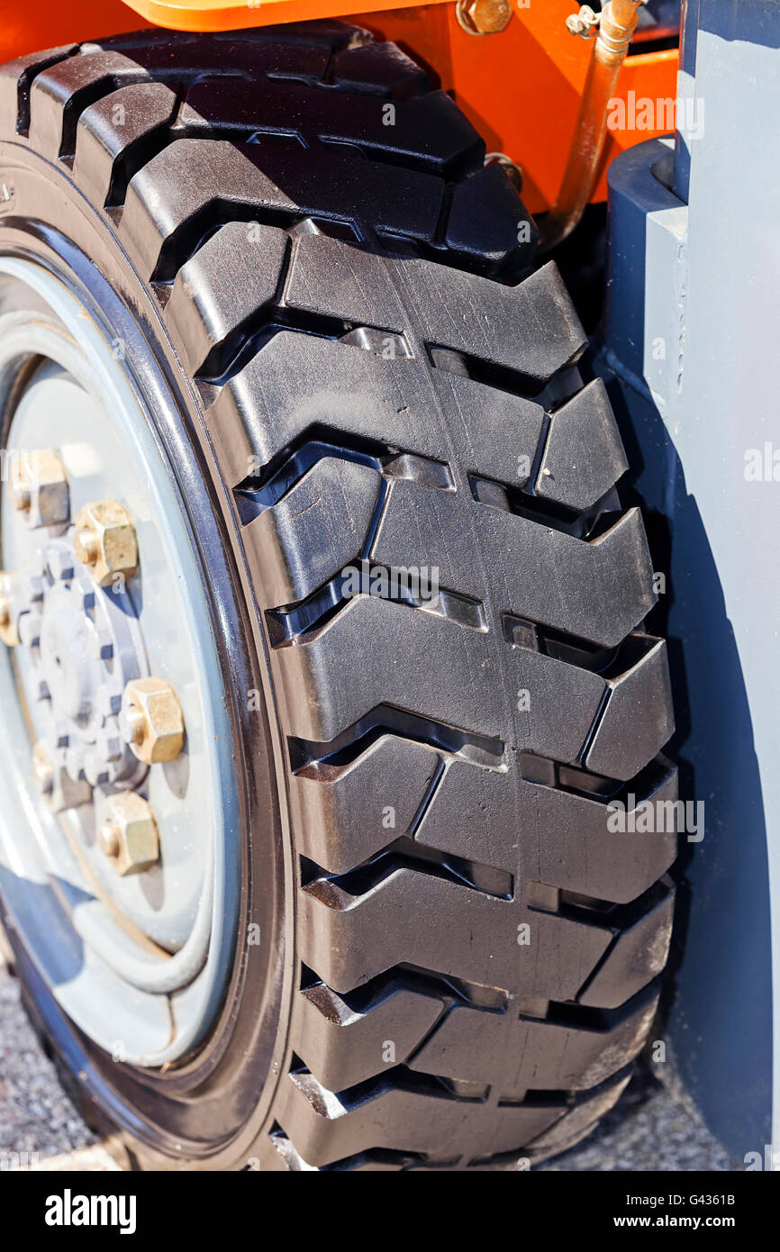 View on wheel of new excavator digging Stock Photo - Alamy