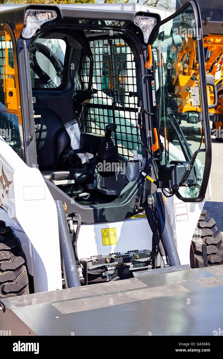 View on chair of new excavator digging Stock Photo - Alamy