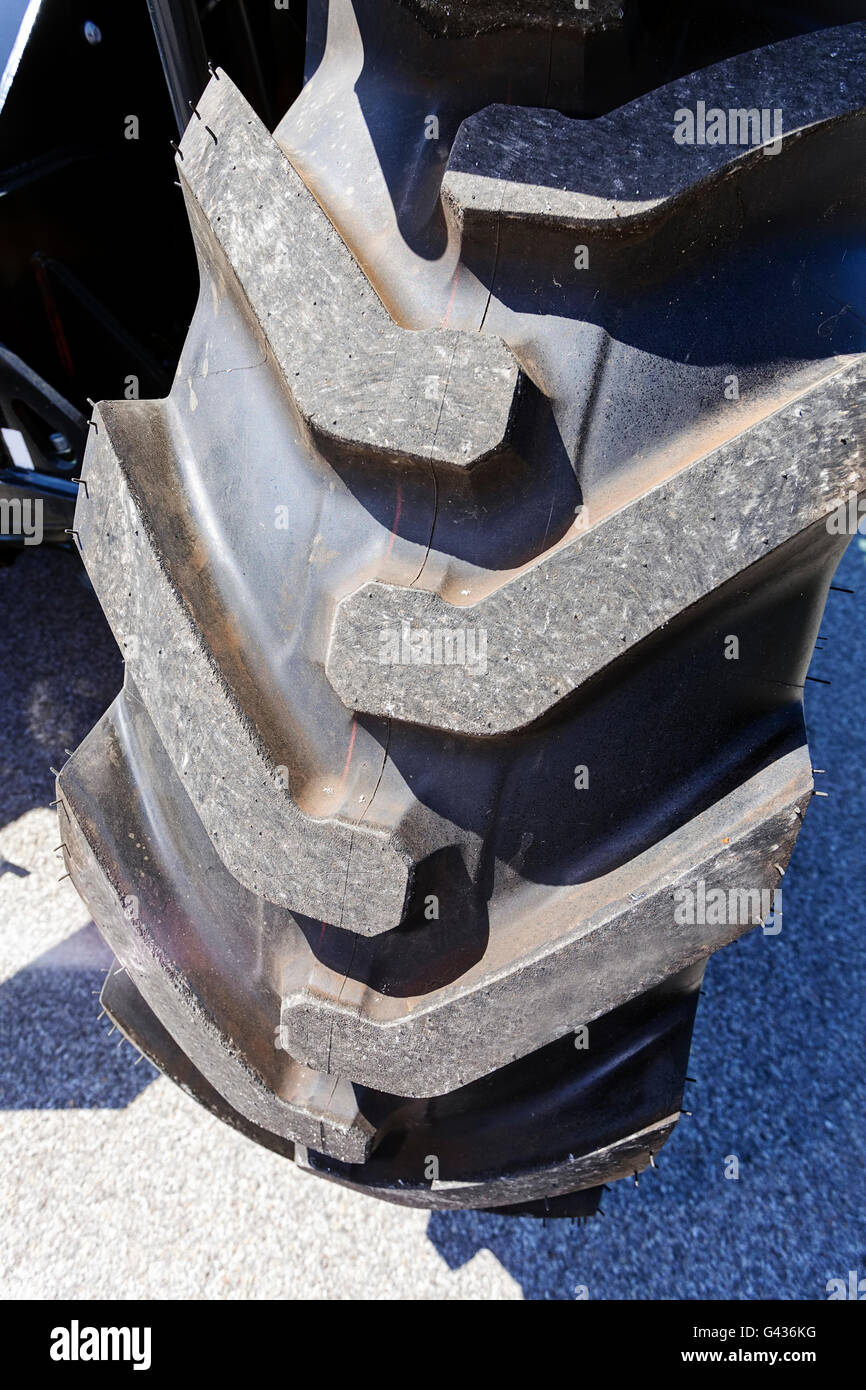 View on tire of new excavator digging Stock Photo - Alamy