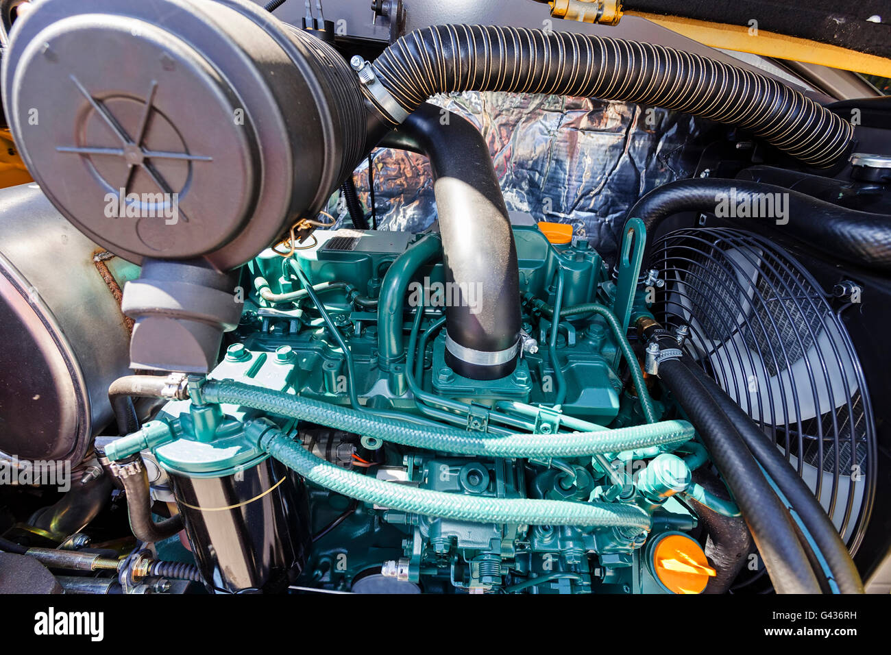 View on motor of new excavator digging Stock Photo - Alamy