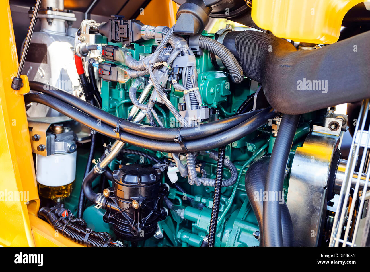 View on motor of new excavator digging Stock Photo - Alamy