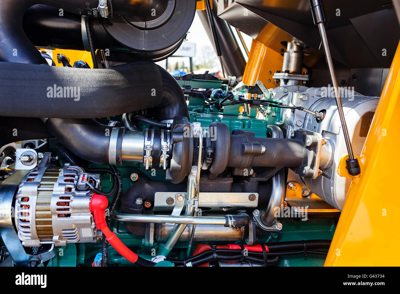 View on motor of new excavator digging Stock Photo - Alamy