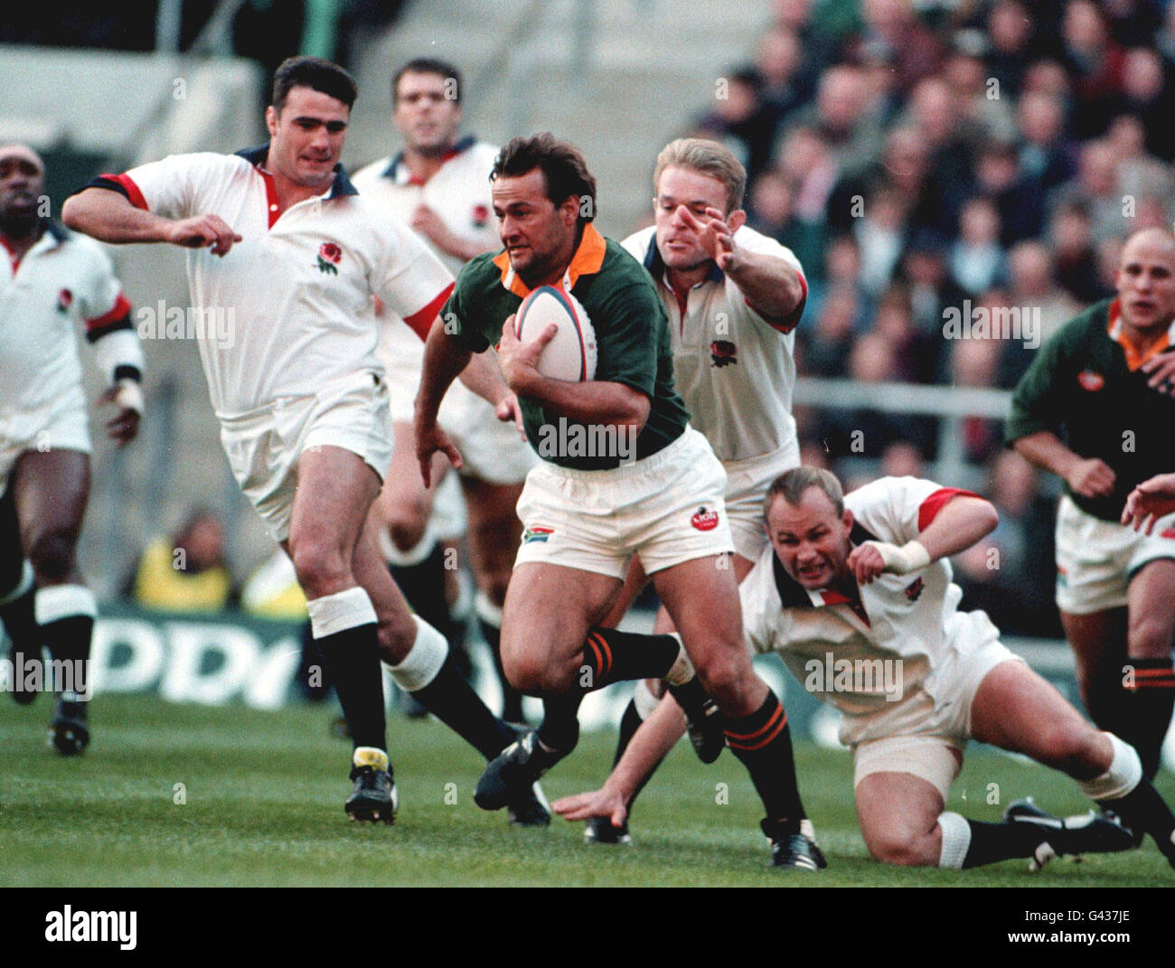 South Africa's Ruben Kruger escapes with the ball with England's Ben ...