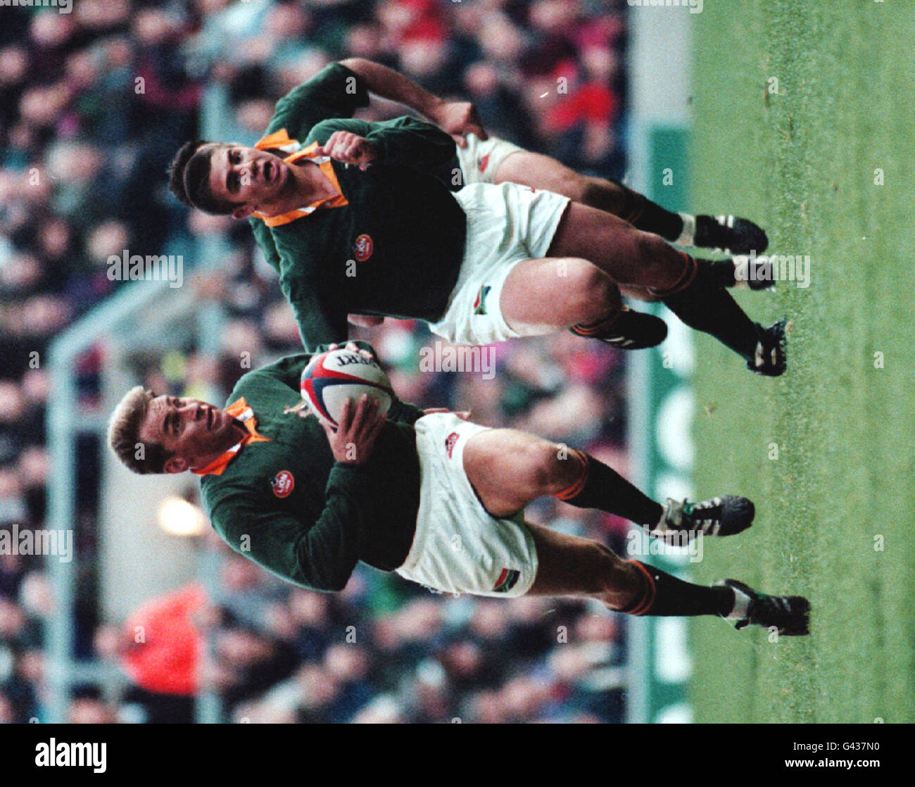 South Africa's Joel Stransky runs with the ball with team-mate Jacobus ...
