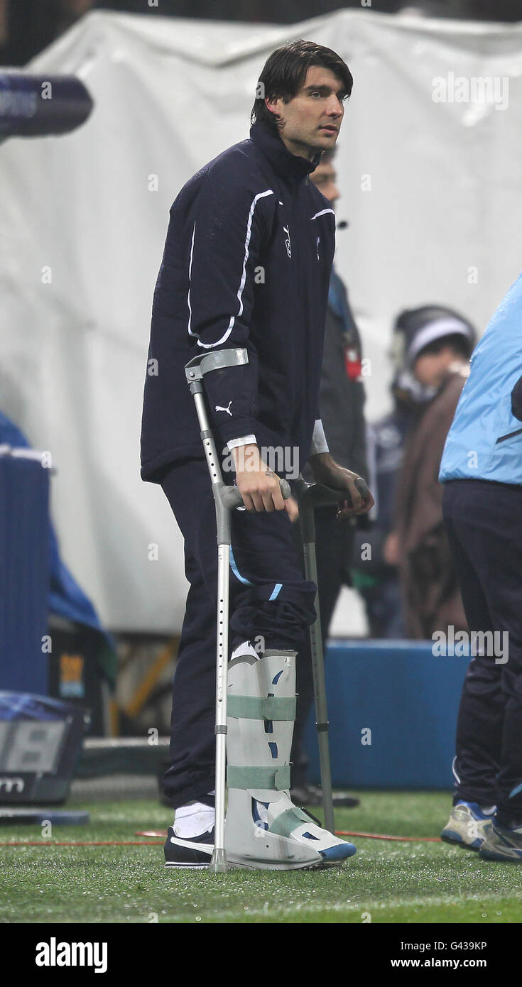 Tottenham Hotspur's Vedran Corluka with his leg in a temporary cast ...