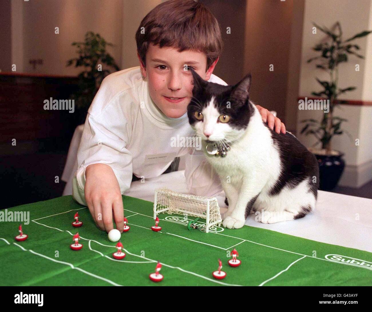 Jimmy the cat, a keen Subbuteo player, with his owner, Andrew Tierney ...