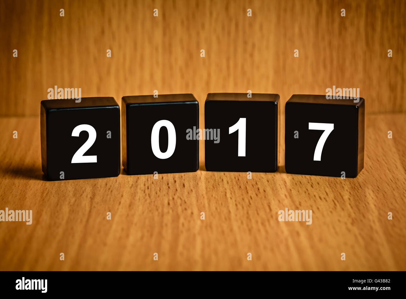 Happy new year 2017 text on black block Stock Photo - Alamy