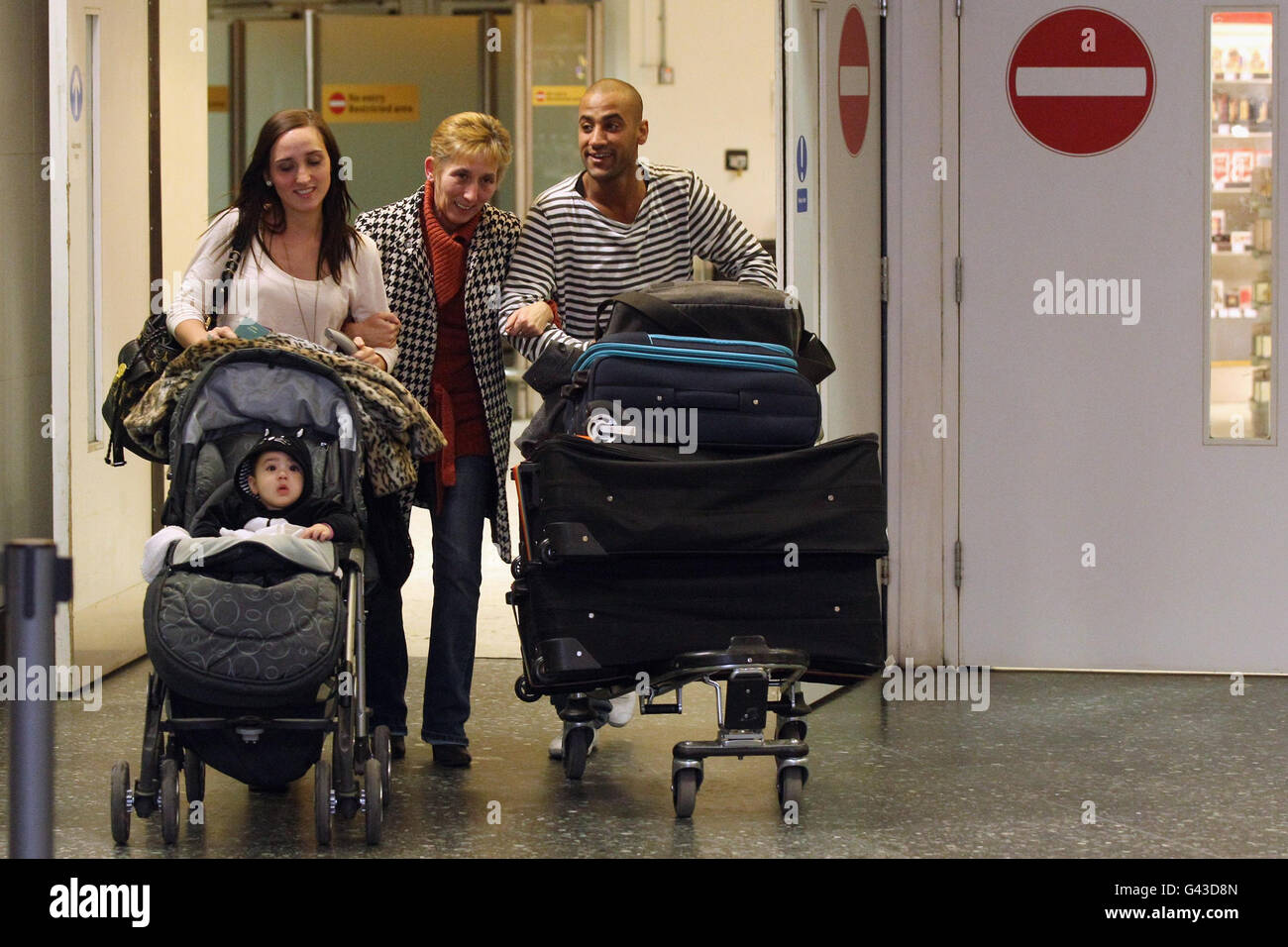 Maria Harkin (centre) greets her daughter Stephanie Harkin, son-in-law ...