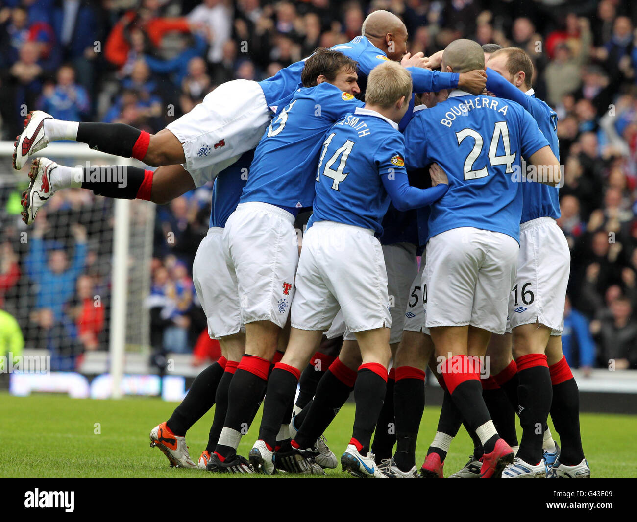 Rangers players celebrate after Jamie Ness (hidden) scored his sides ...