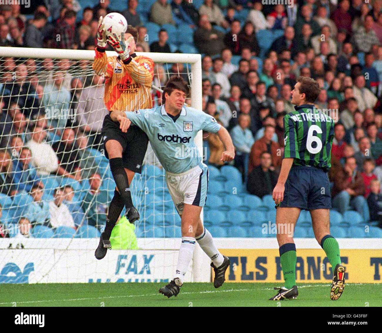 City striker Nial Quinn challenges Leeds keeper John Lukic as David ...