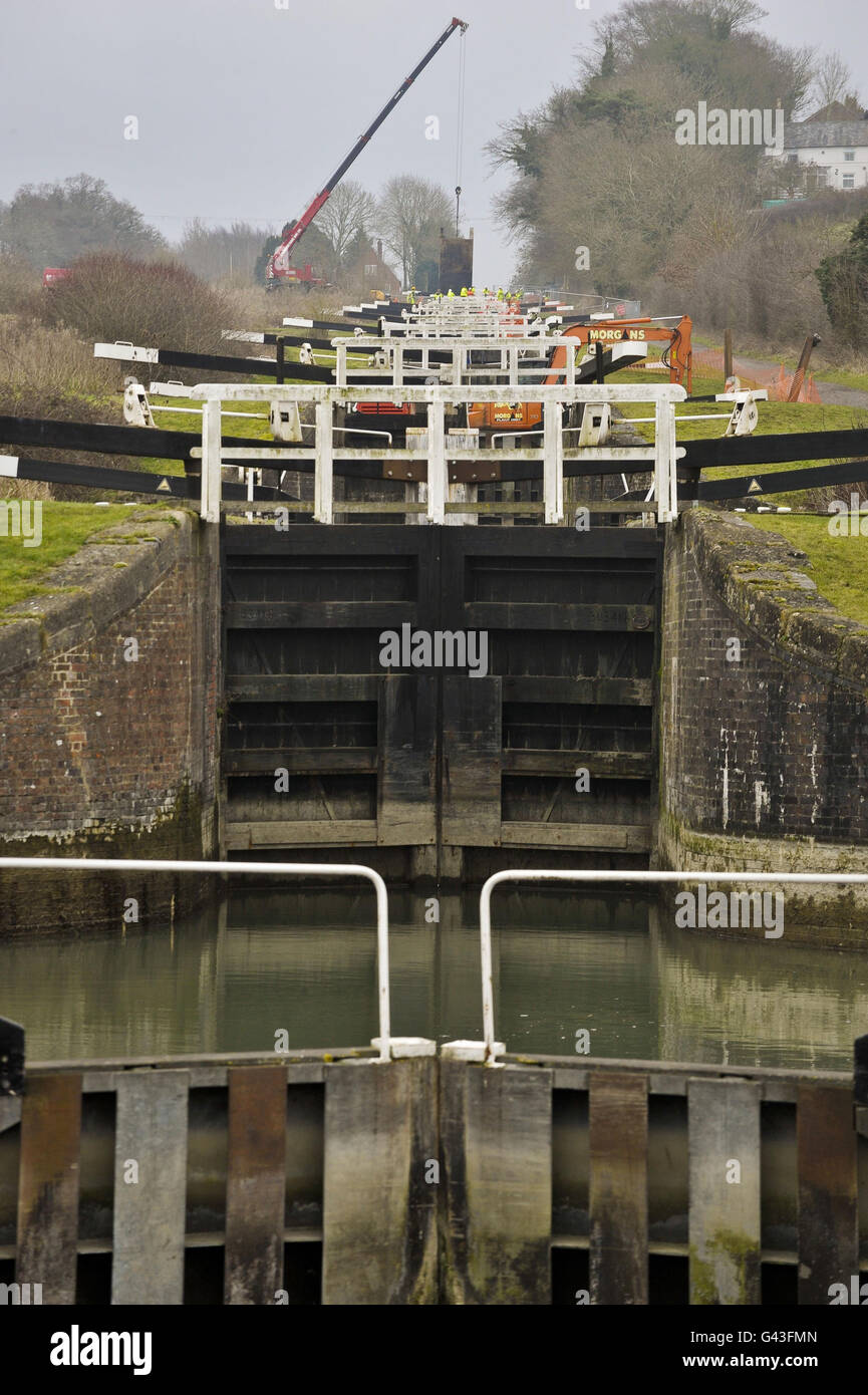 A crane lowers the three tonne solid oak lock number 39 into place ...