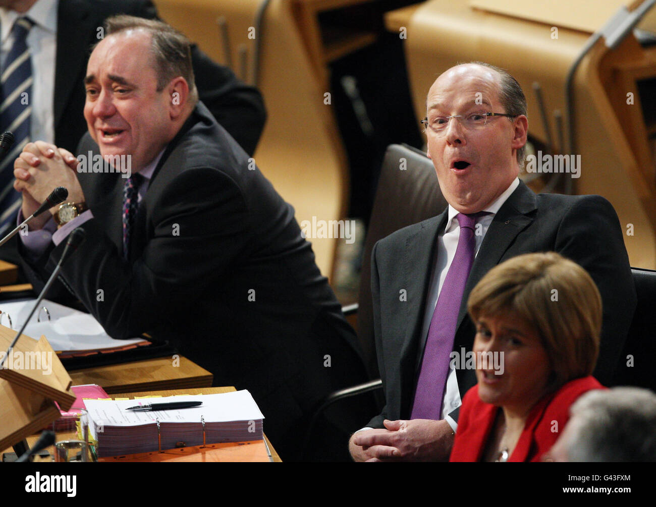 Finance Secretary John Swinney (right) sits with First Minister Alex ...
