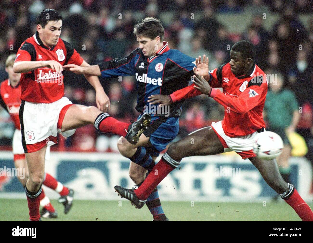 Notts Forest's Steve Chettle clears past teammate Kevin Campbell and ...