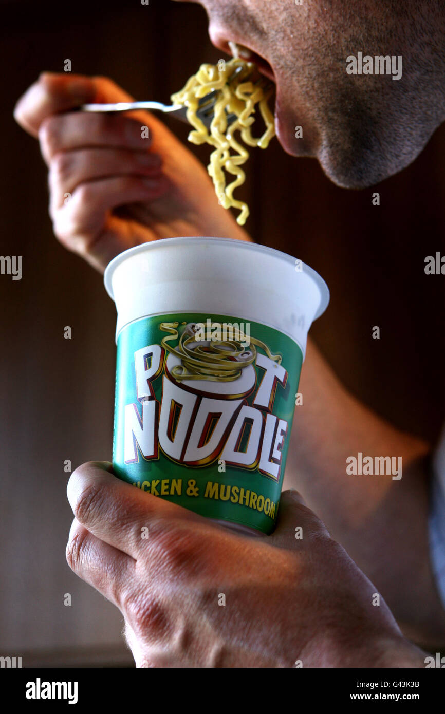 Man eating pot noodle hi-res stock photography and images - Alamy