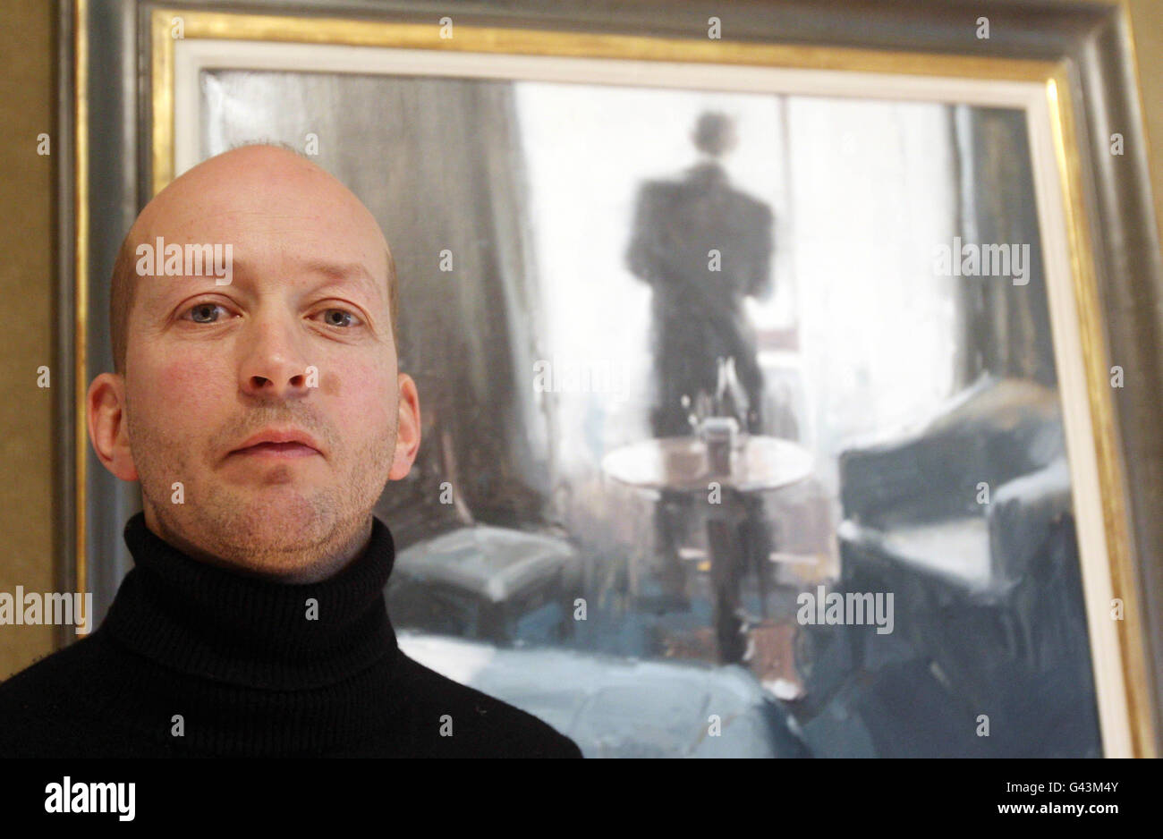 MI6 Art Exhibition. Artist James Hart Dyke with his paintings of 'A ...