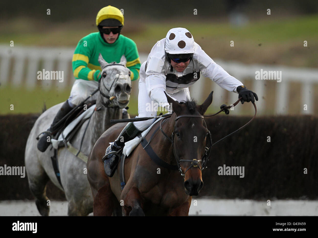 William Somers ridden by jockey Mark Wall jumps the last fence to win ...