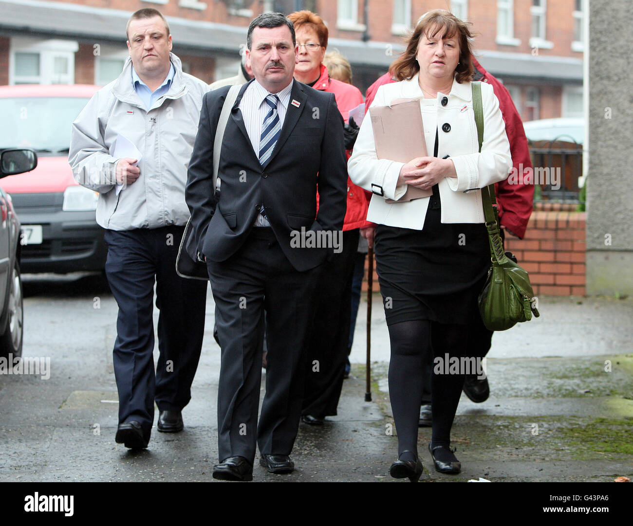 John Taggart (centre) leads a delegation representing the families of ...