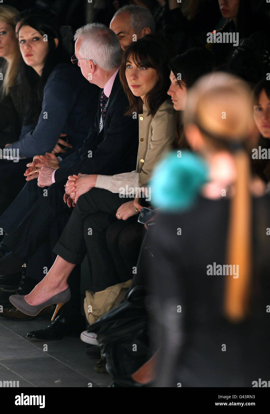 Samantha Cameron (beige jacket) watches the David Koma catwalk show as ...