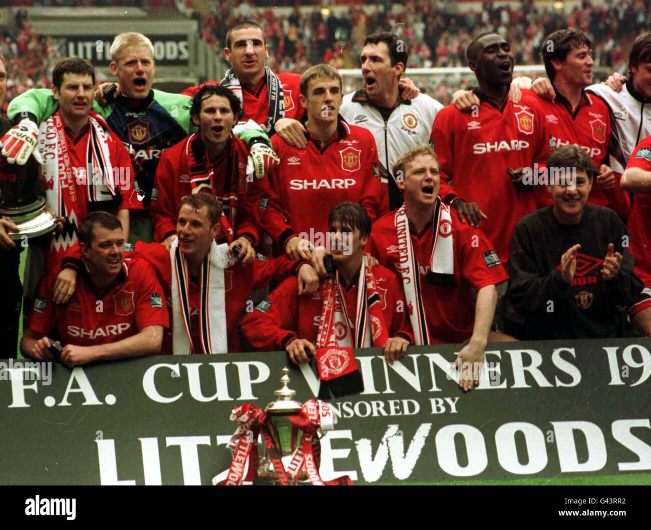 Team with Cup Stock Photo - Alamy