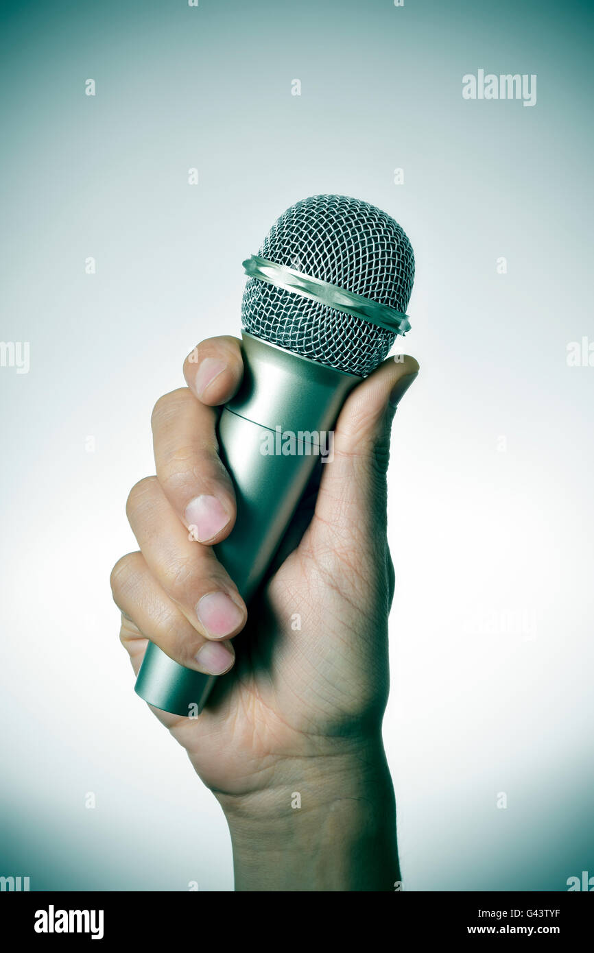 Singer microphone hand hi-res stock photography and images - Alamy