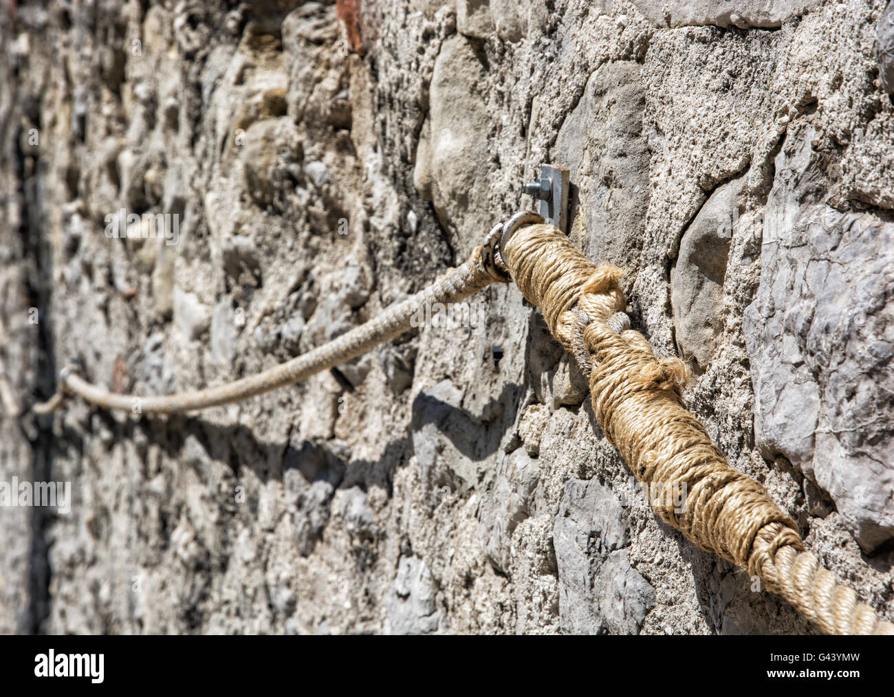 Old wall of castle ruins with the rope. Ancient wall. Tourism theme ...