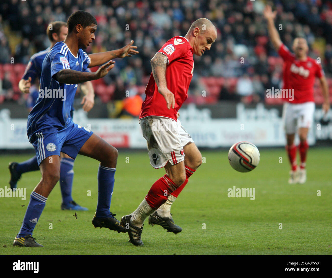 Charlton Athletic's Alan McCormack shields the ball from Peterborough ...