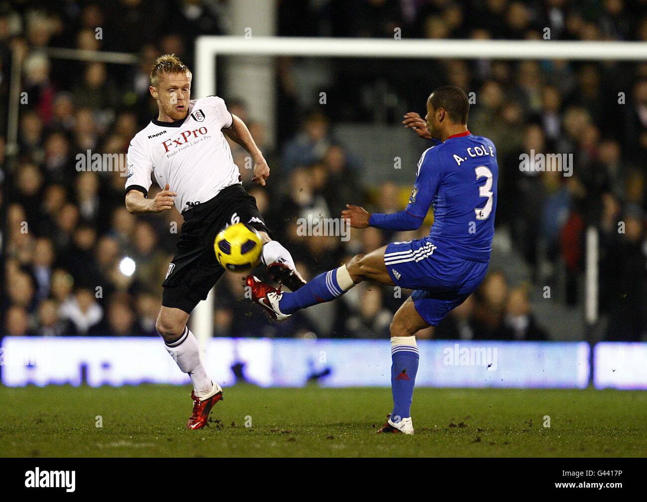 Chelsea's Ashley Cole (right) and Fulham's Damien Duff battle for the ...
