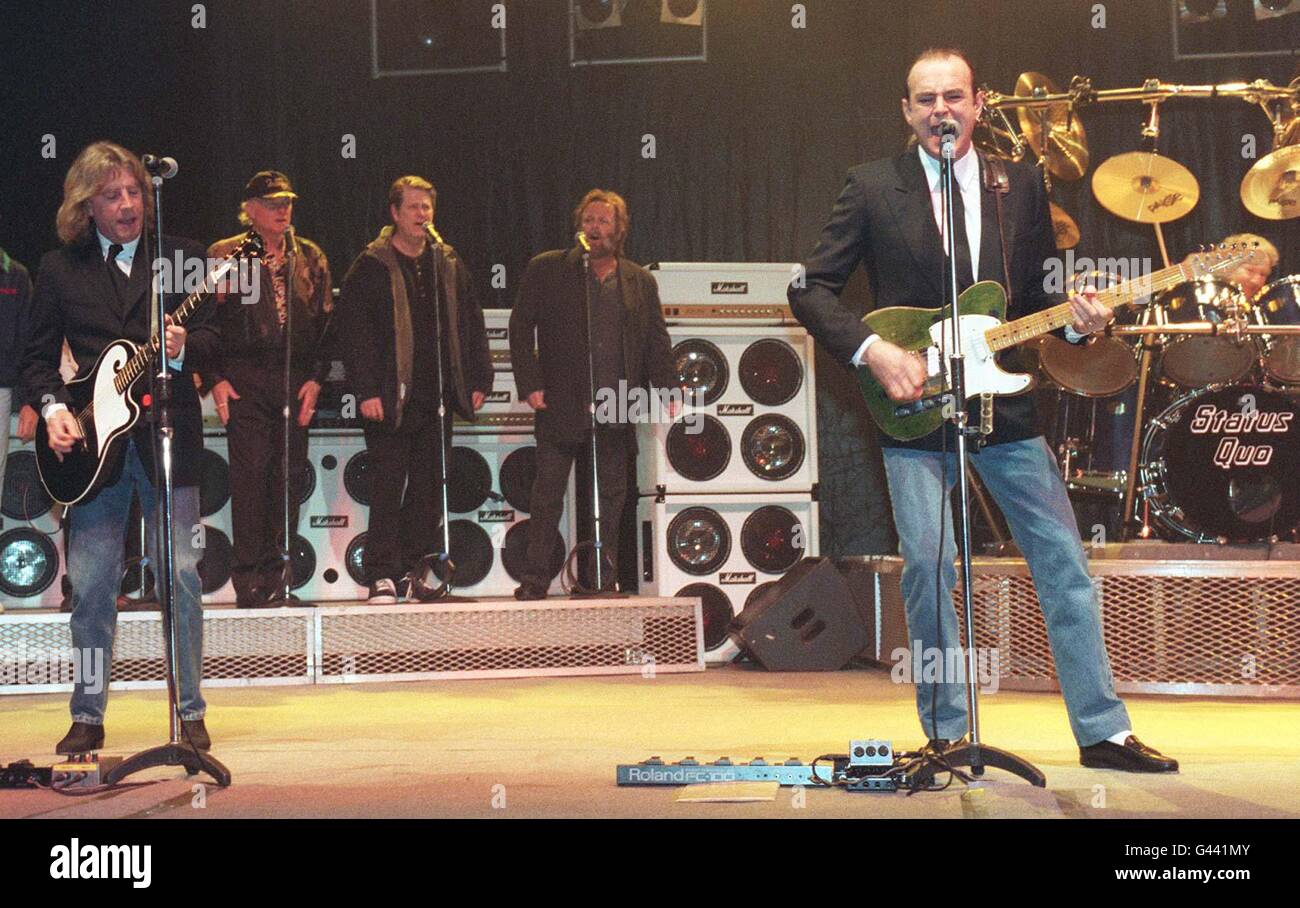 Status Quo's Rick Parfitt (left) and Francis Rossi are joined on stage ...