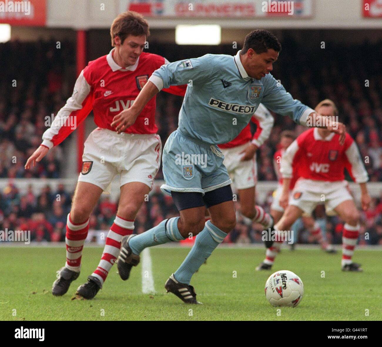 Arsenal v Coventry 2. Coventry's John Salako holds off Adrian Clark ...