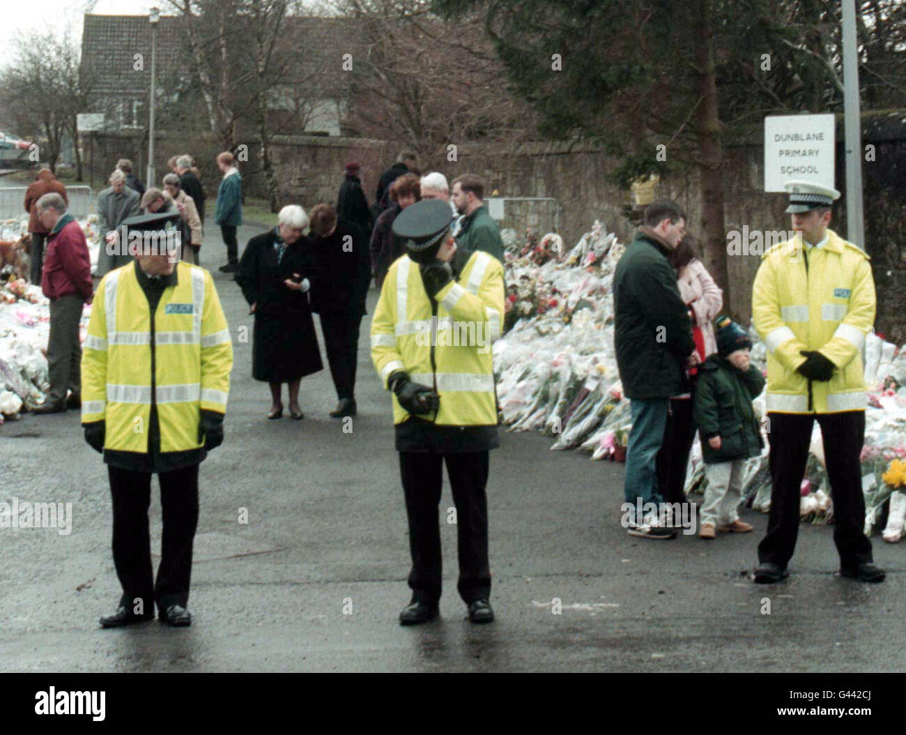Policeman crying during minutes silence at Dunblane Stock Photo - Alamy