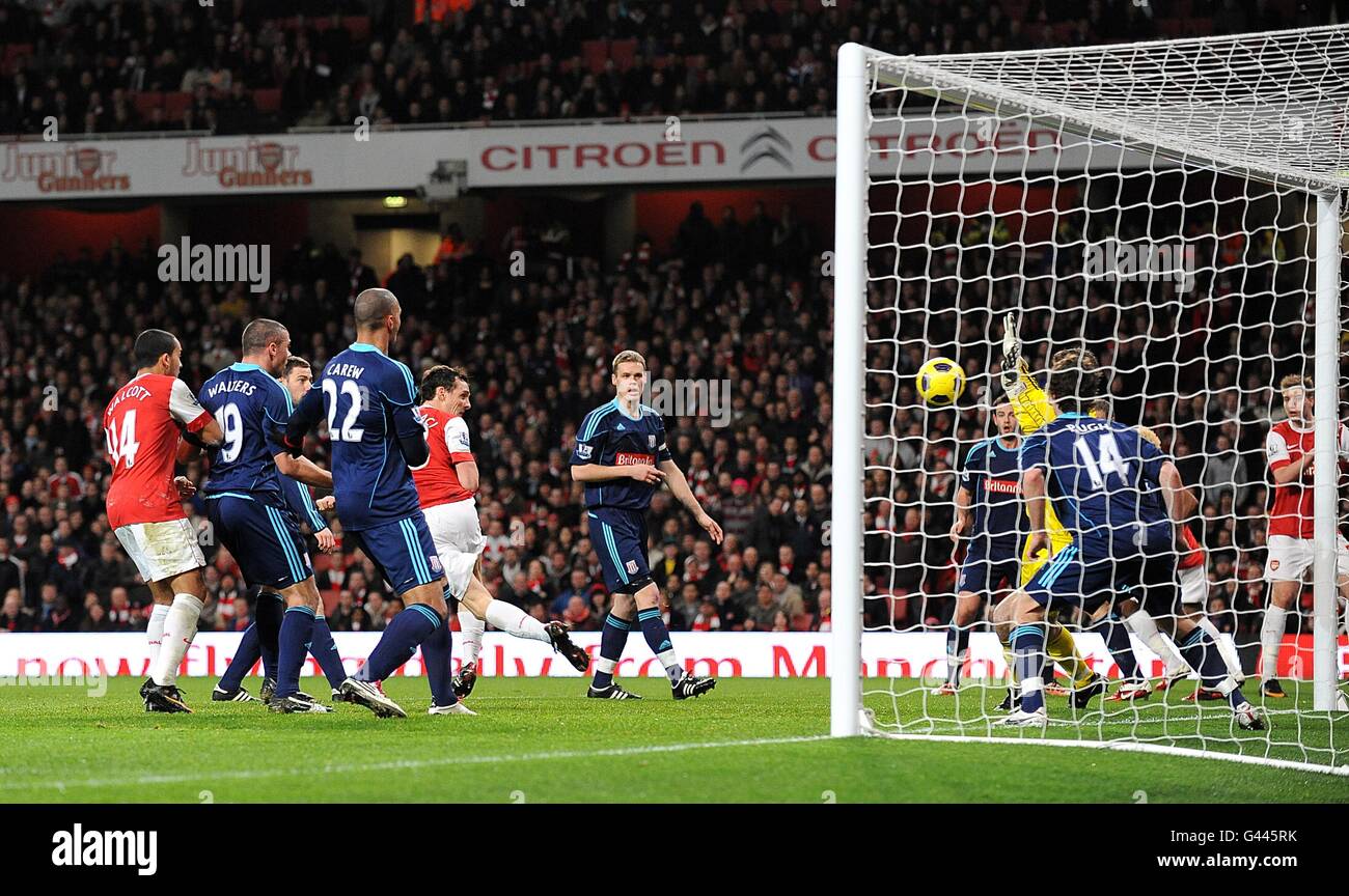 Arsenal's Sebastien Squillaci (fourth left) scores his team's opening ...