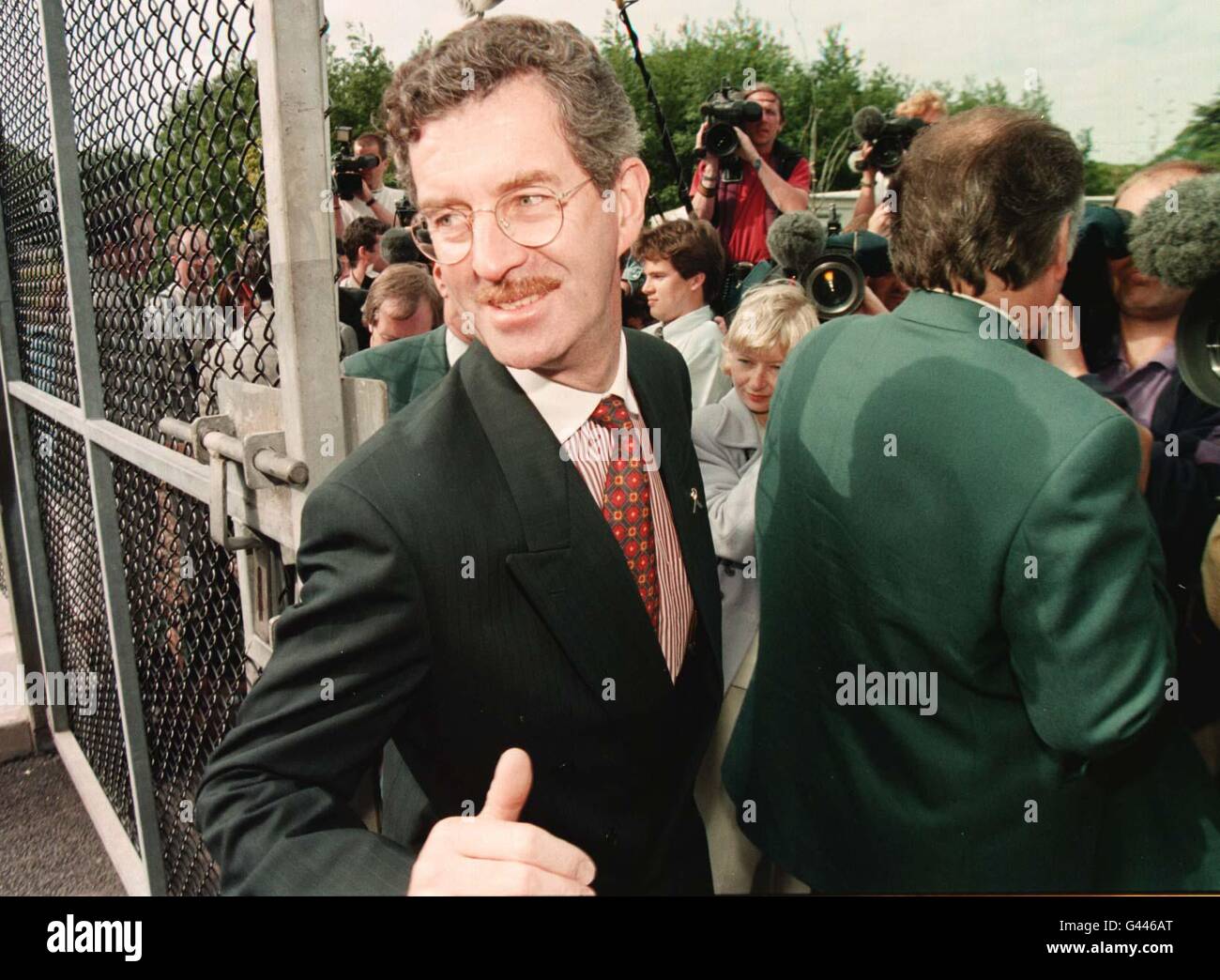 Tanaiste Dick Spring squeezes through the gates at Castle Buildings ...