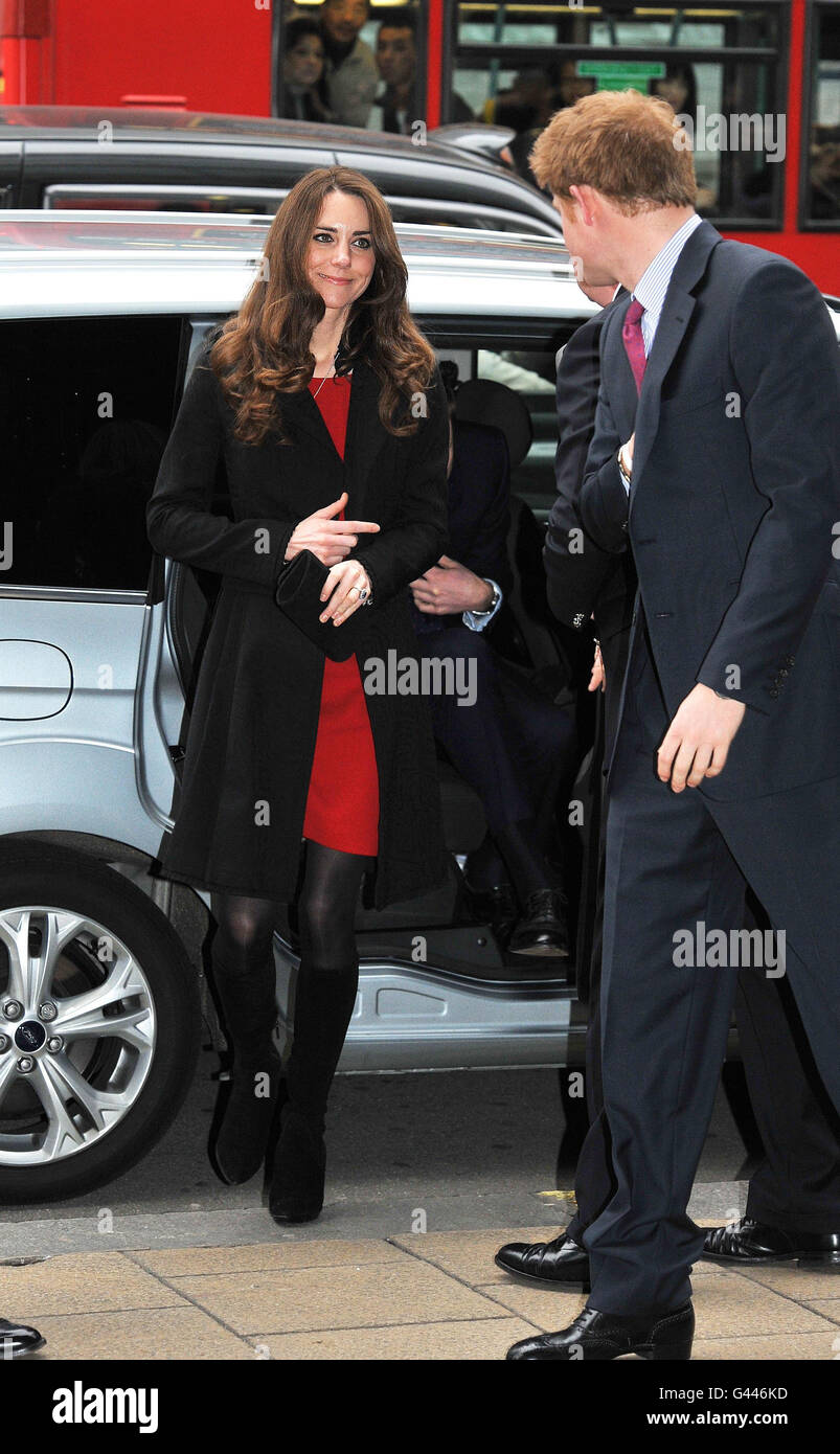 Kate Middleton and Prince Harry arrive to sign the book of condolence ...