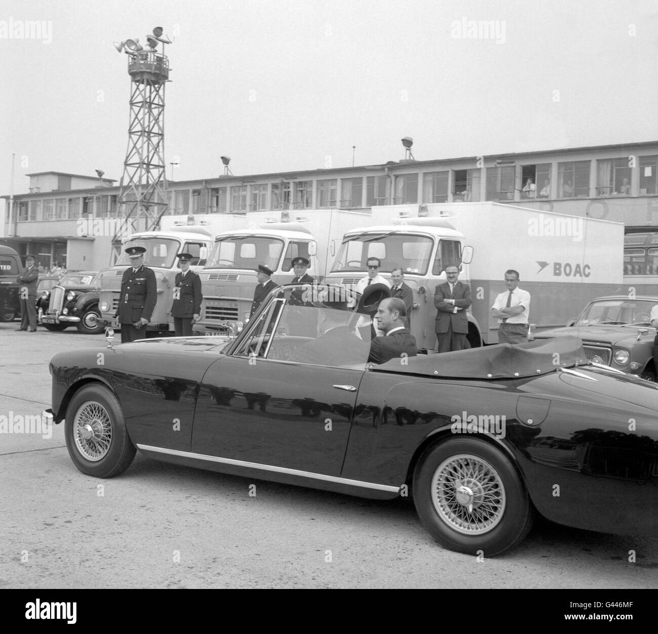 The Duke of Edinburgh raises his hat as he drives off from Heathrow ...
