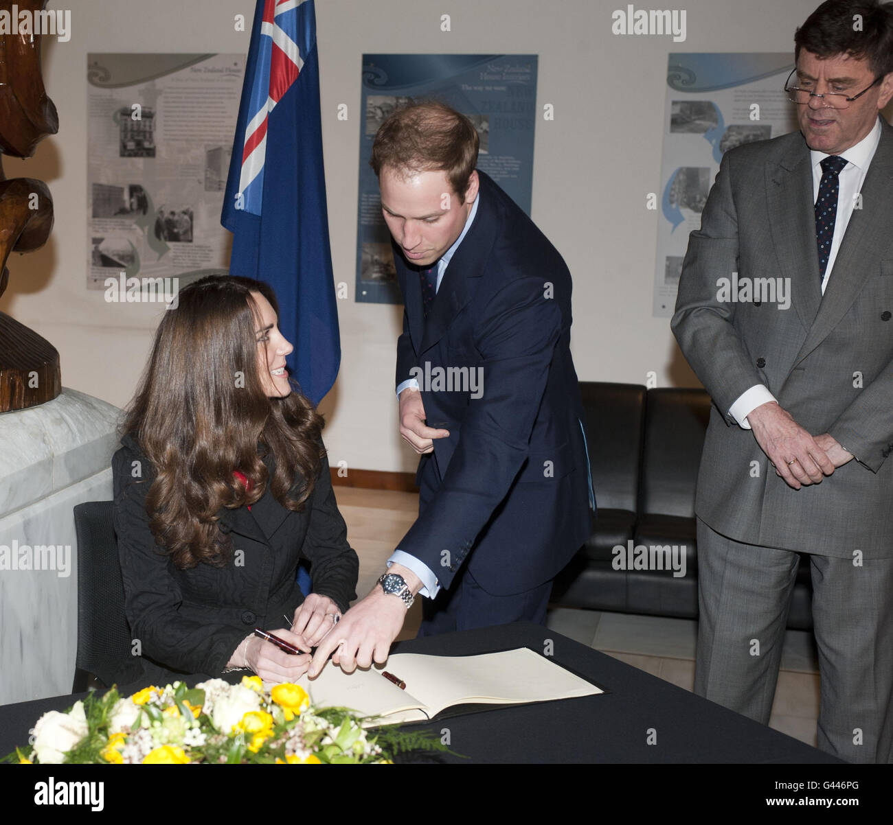 Watched by High Commissioner Derek Leask (right), Prince William and ...