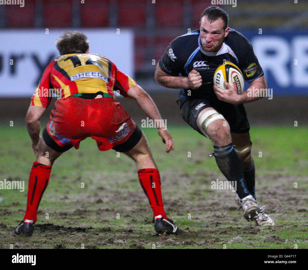 Glasgow's James Eddie and Newport Gwent Dragon's Adam Hughes during the ...
