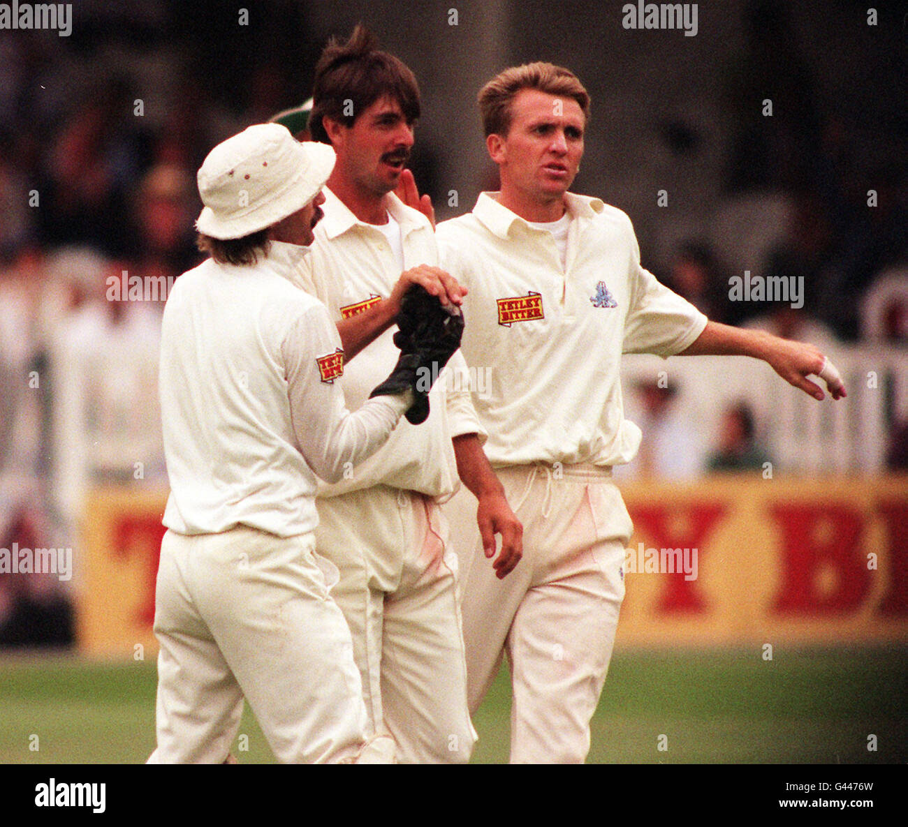 Dominic Cork (right) and Jack Russell (left) congratulate Simon Brown ...